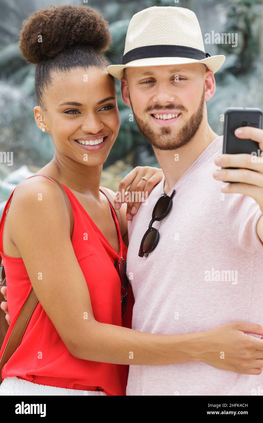 young couple pose for holiday selfie Stock Photo - Alamy
