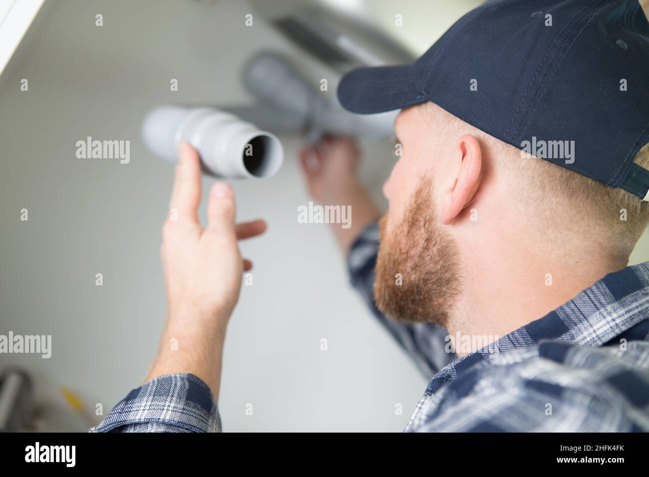 Fixing leaking pipes hi-res stock photography and images - Alamy