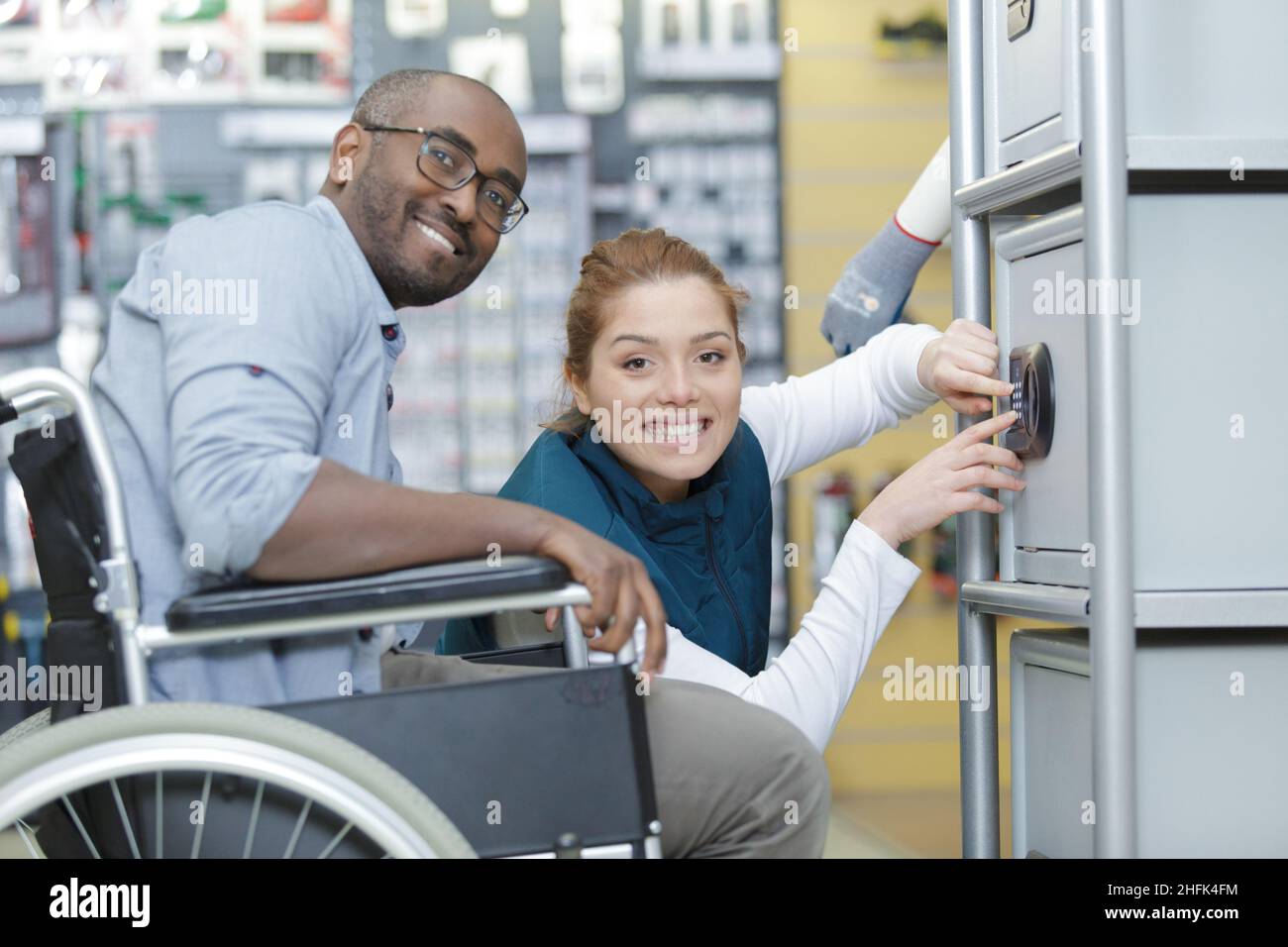 disabled man shopping in a hardware store Stock Photo - Alamy
