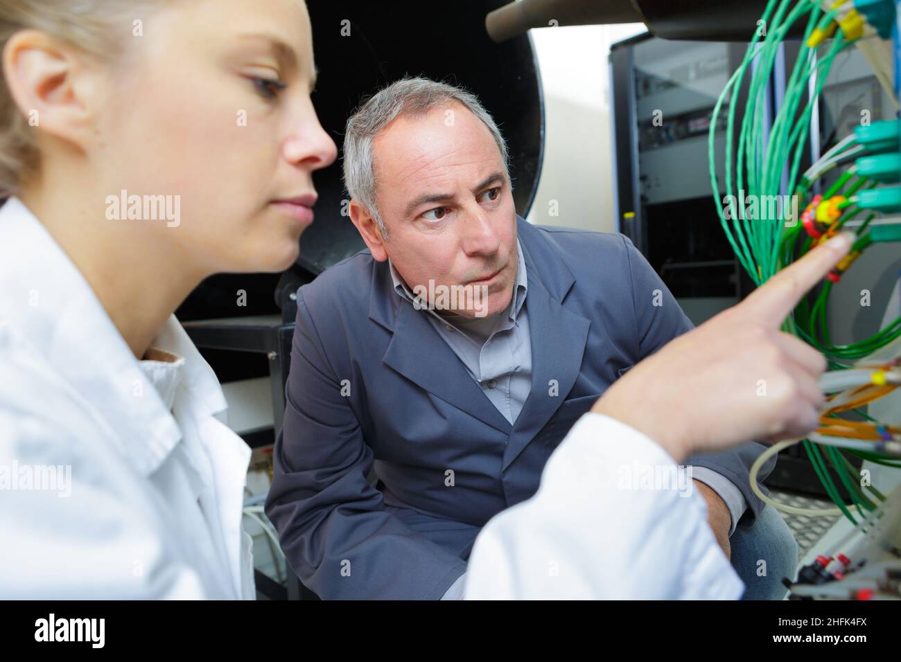 technicians are cutting and fusion fiber optic cables Stock Photo - Alamy