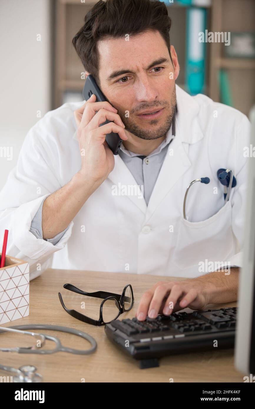 doctor with prescription calling on phone Stock Photo - Alamy
