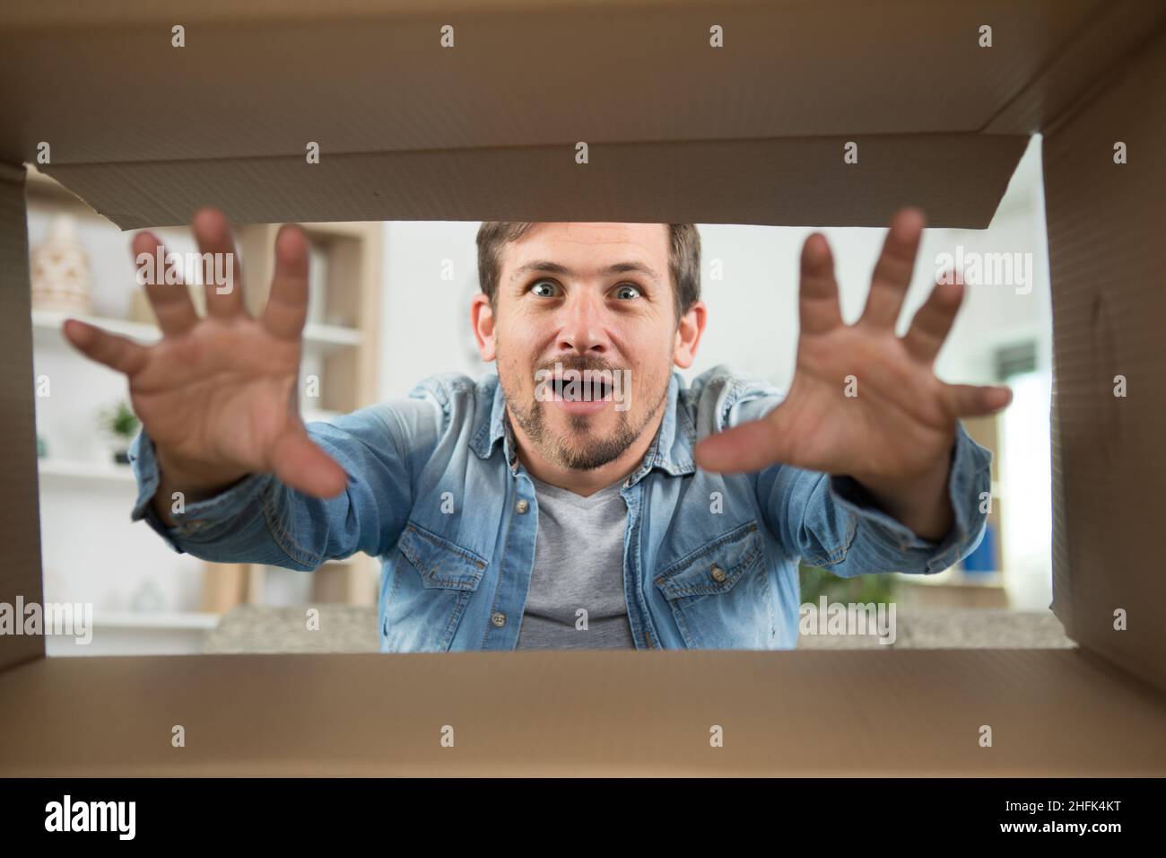 Asian male unboxing cardboard box hi-res stock photography and images ...