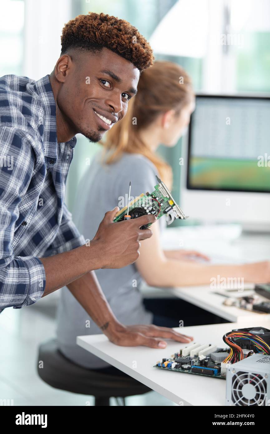 Male tech repairs electronic equipment hi-res stock photography and ...
