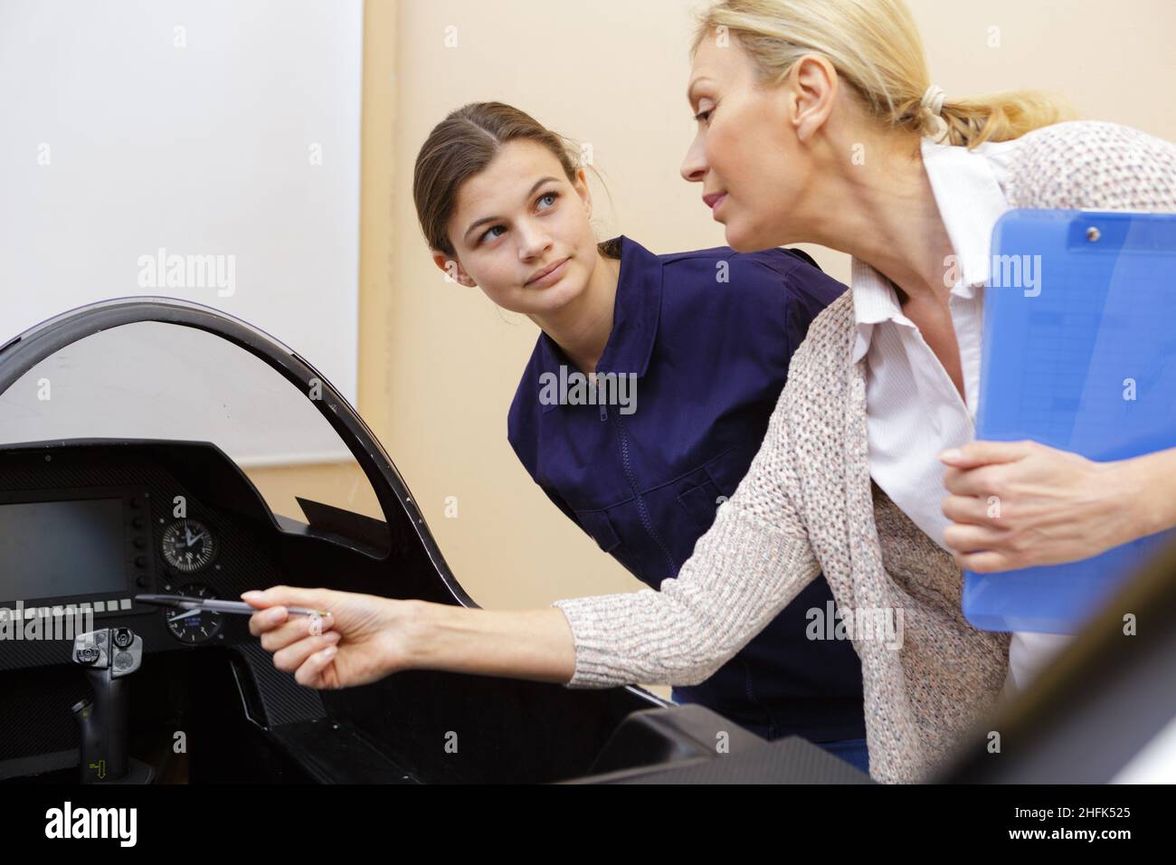 a female pilot with instructor Stock Photo - Alamy