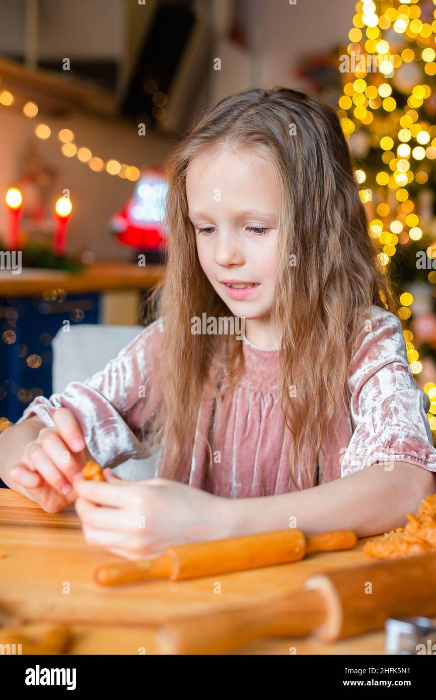 Adorable happy little girl baking Christmas cookies Stock Photo - Alamy
