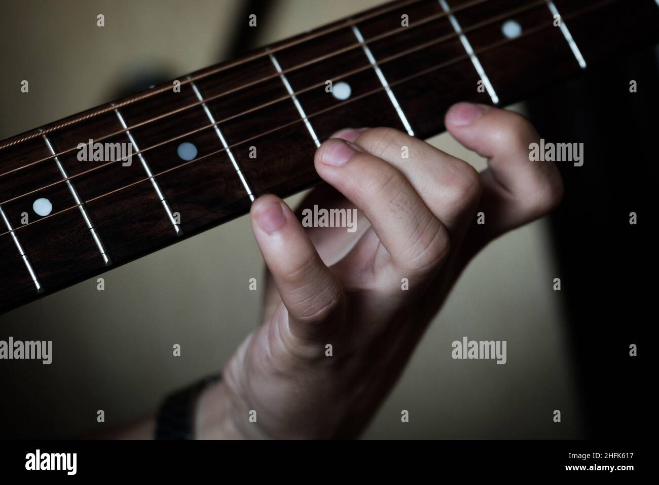 Hand on guitar hi-res stock photography and images - Alamy