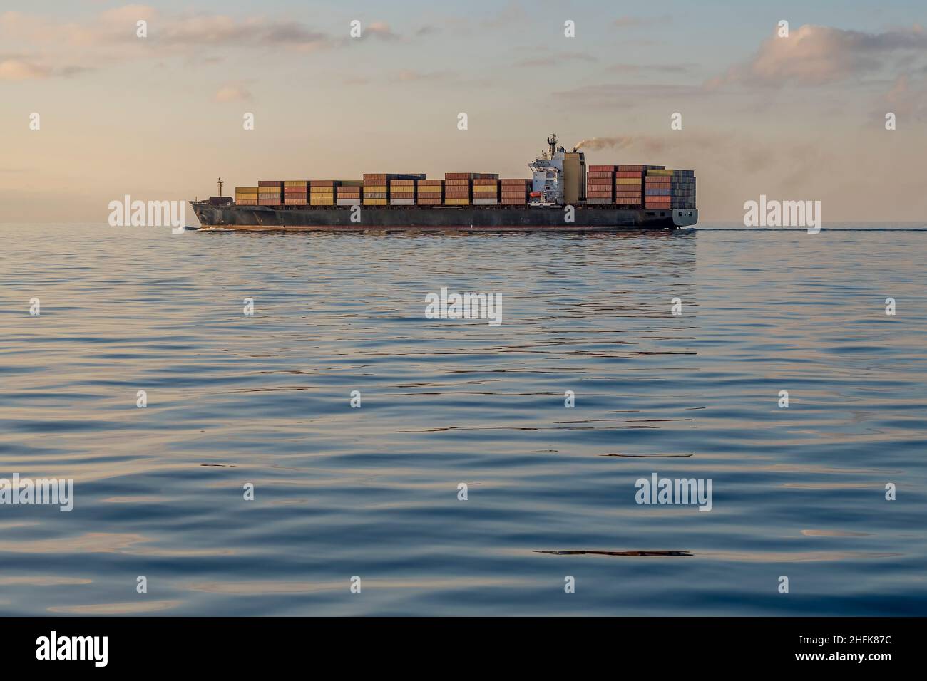 Container ship sea sunset hi-res stock photography and images - Alamy
