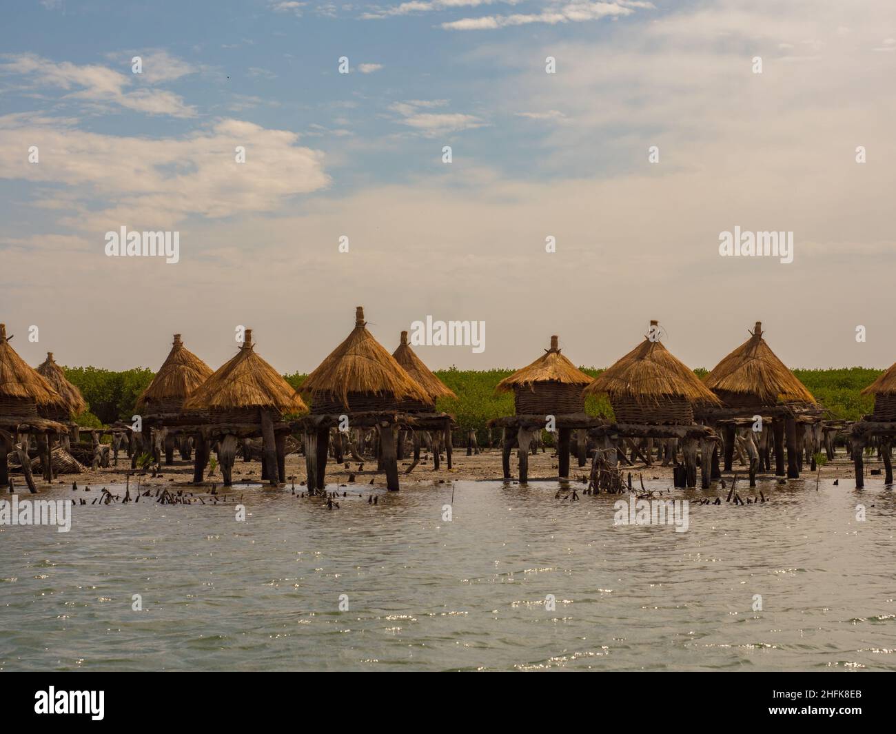 Granaries on a shell island among mangrove trees, Joal-Fadiouth ...