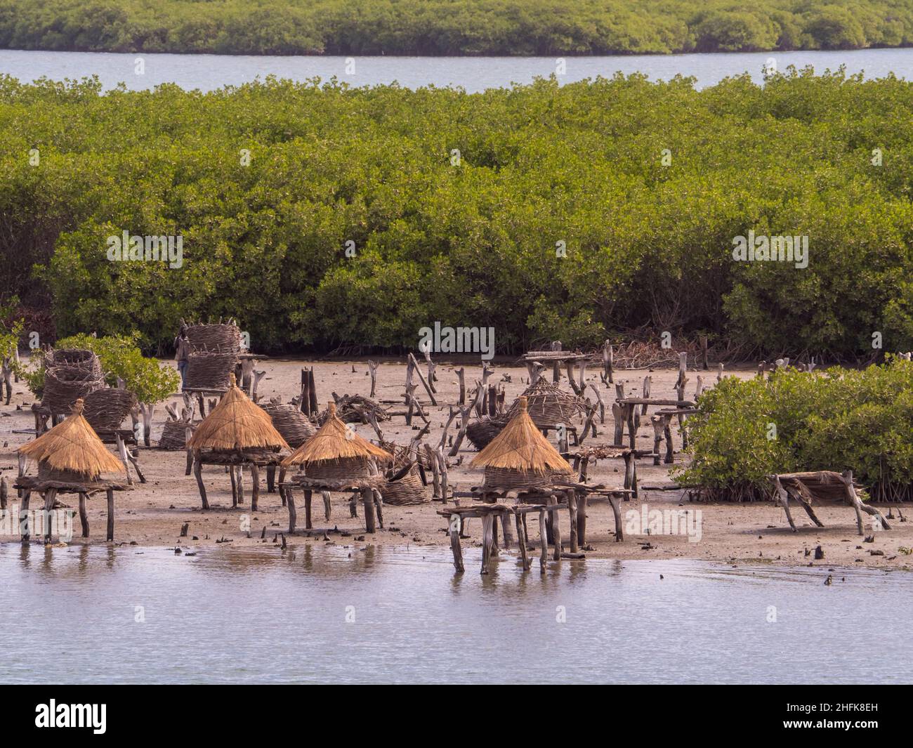 Granaries on a shell island among mangrove trees, Joal-Fadiouth ...