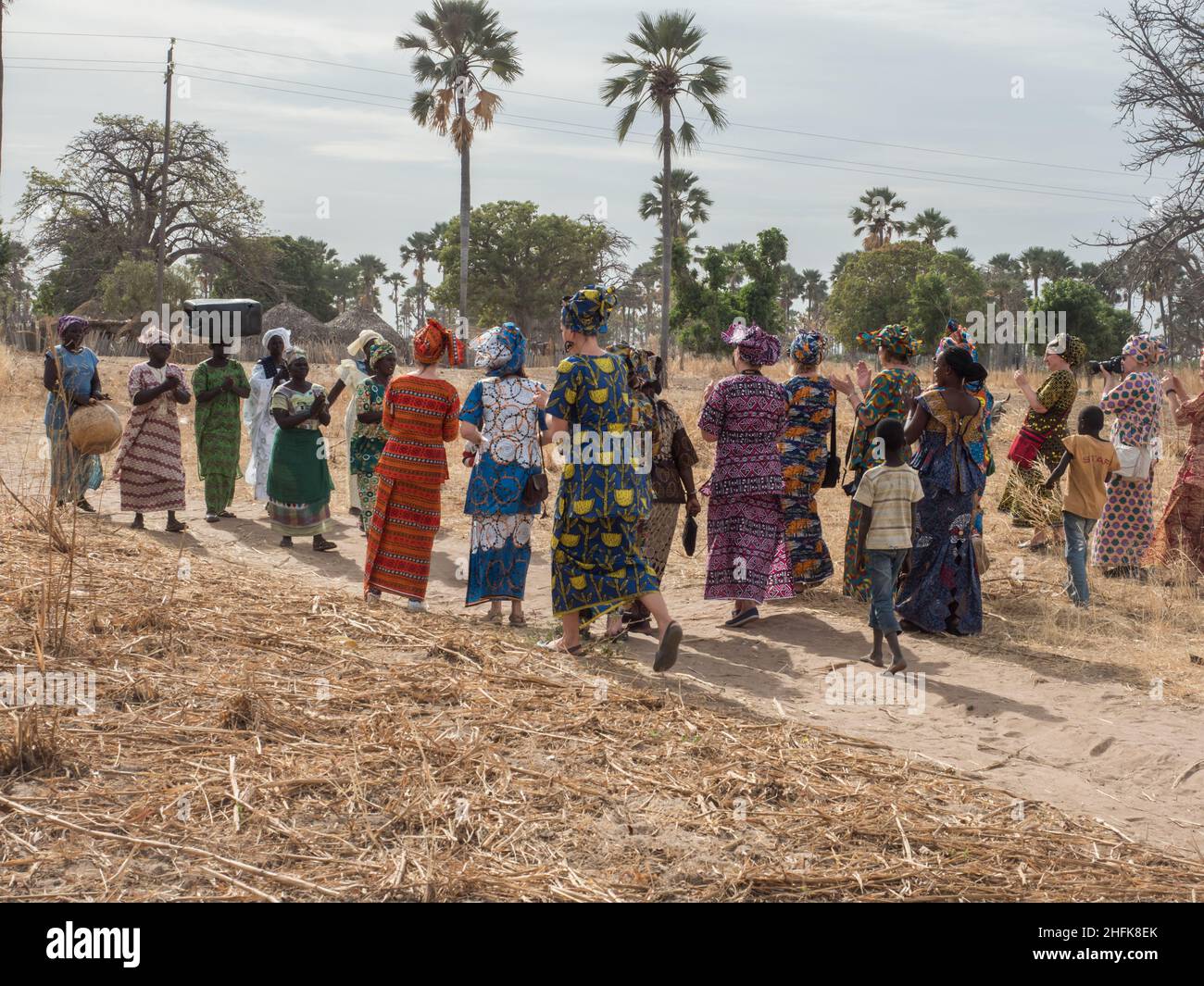 Senegal , Africa- Jan, 2019: Women dancing in a traditional costumes ...