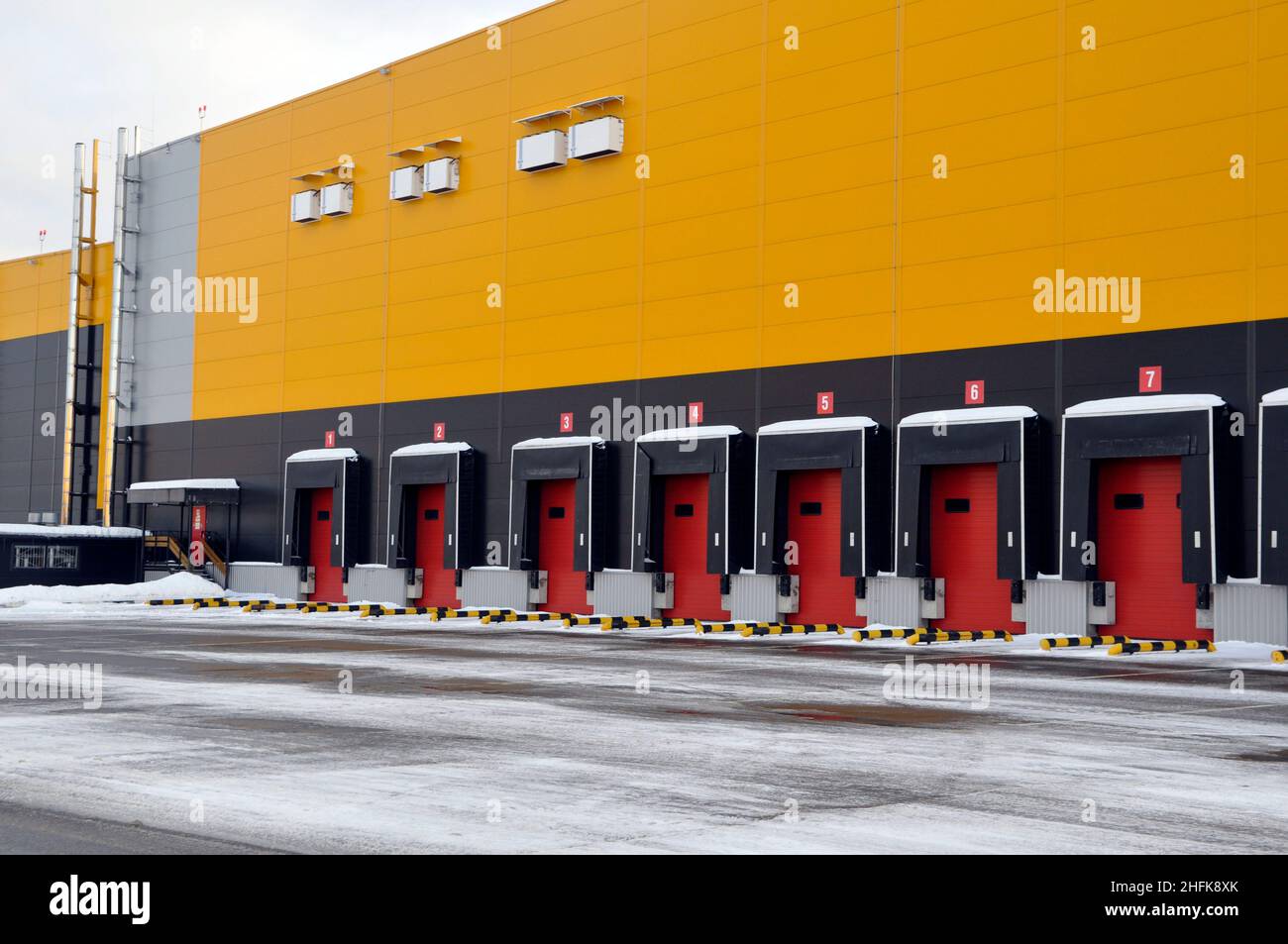 Exterior view of a large warehouse in winter. Loading docks Stock Photo ...