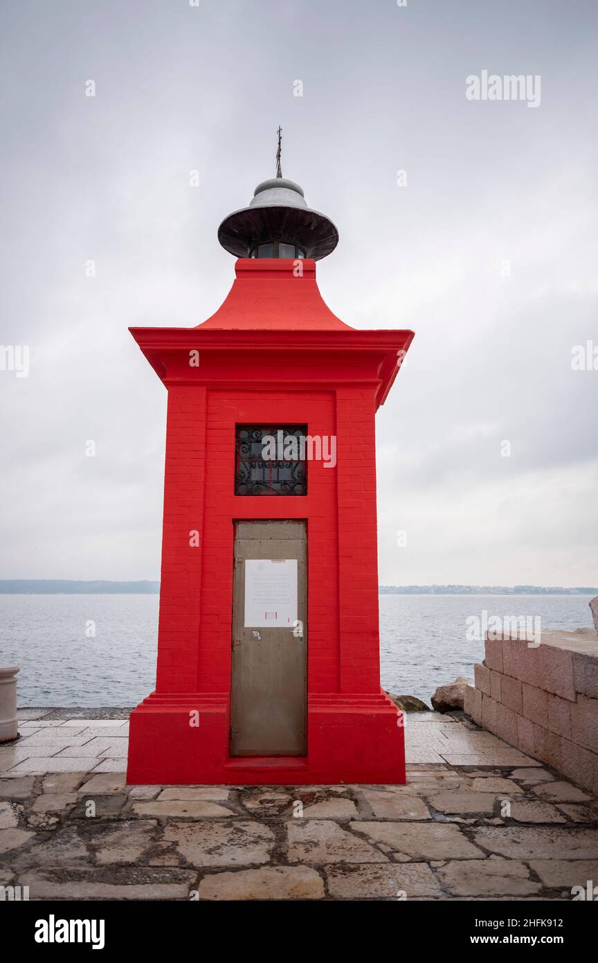 Antique lighthouse by the sea Stock Photo - Alamy
