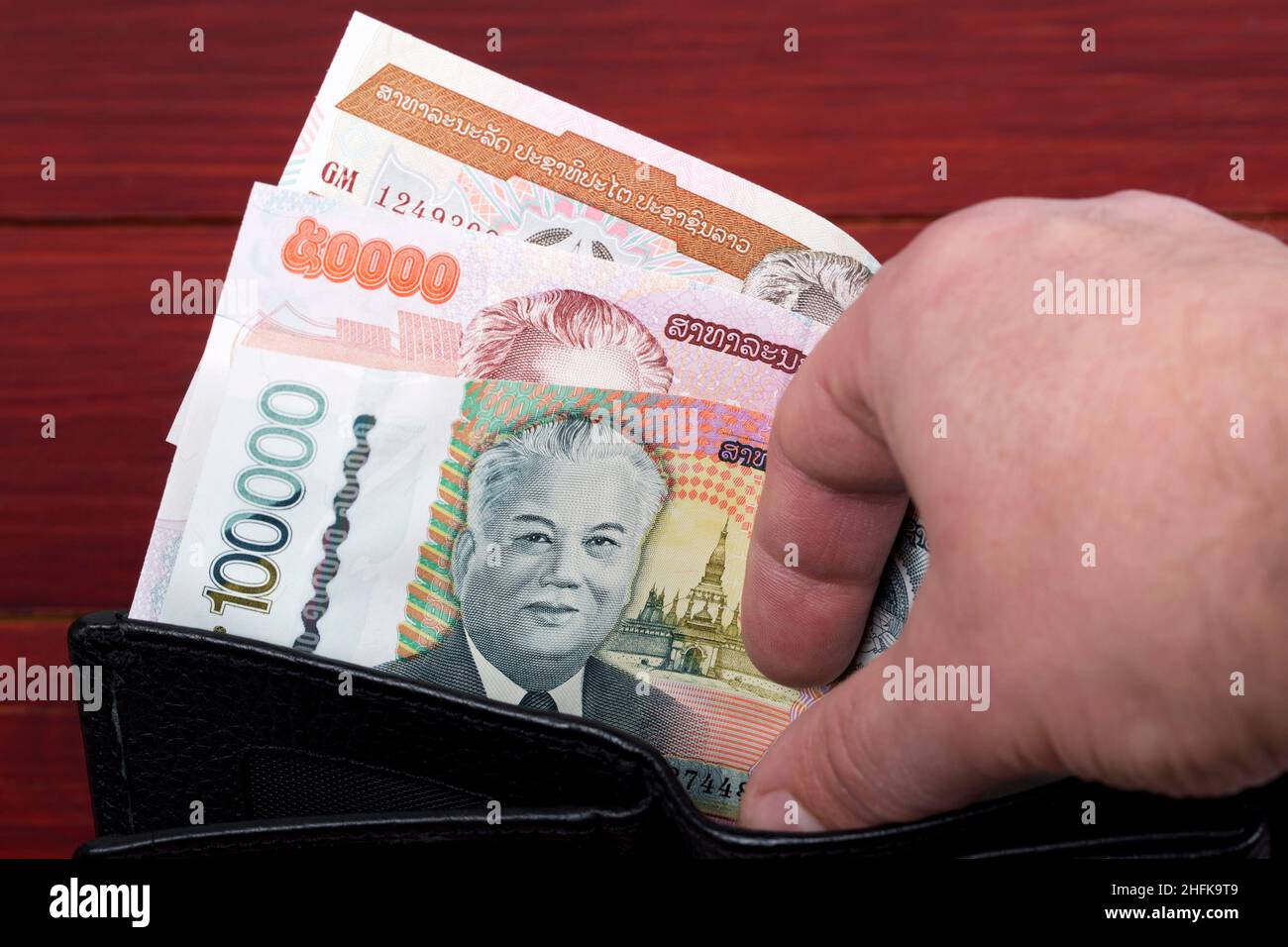 Lao money - kip in the black wallet Stock Photo - Alamy