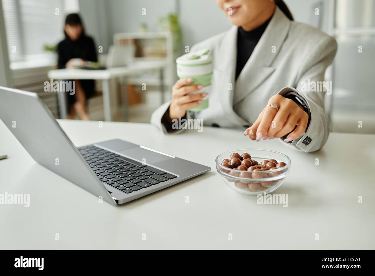 Eating snacks at work desk hi-res stock photography and images - Alamy