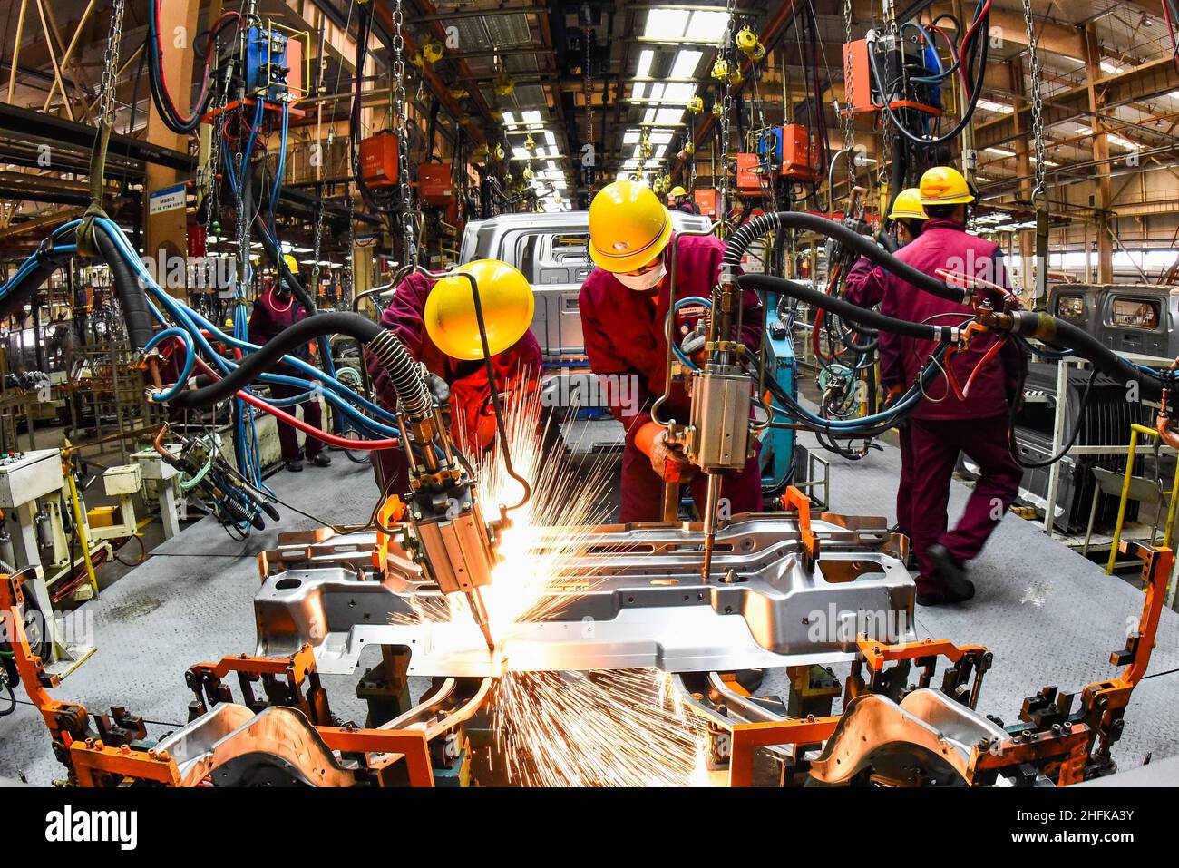 Beijing, China's Shandong Province. 28th Feb, 2021. Workers weld ...