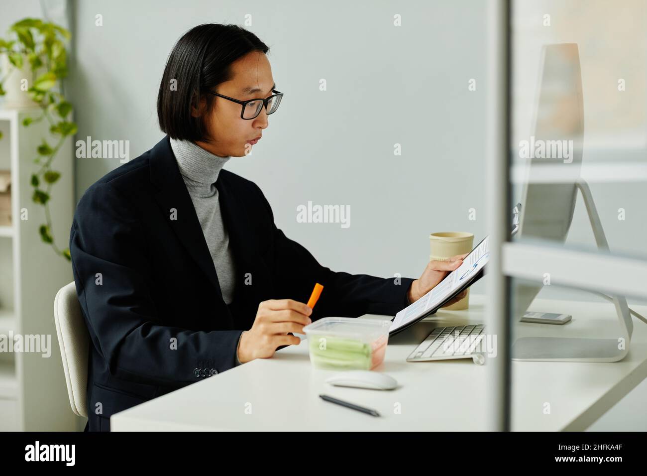 Business person eating healthy snack hi-res stock photography and ...