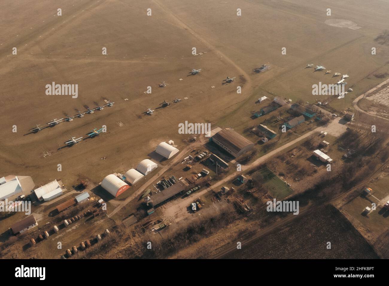 Sports airfield with planes and helicopters near the runway - aerial ...