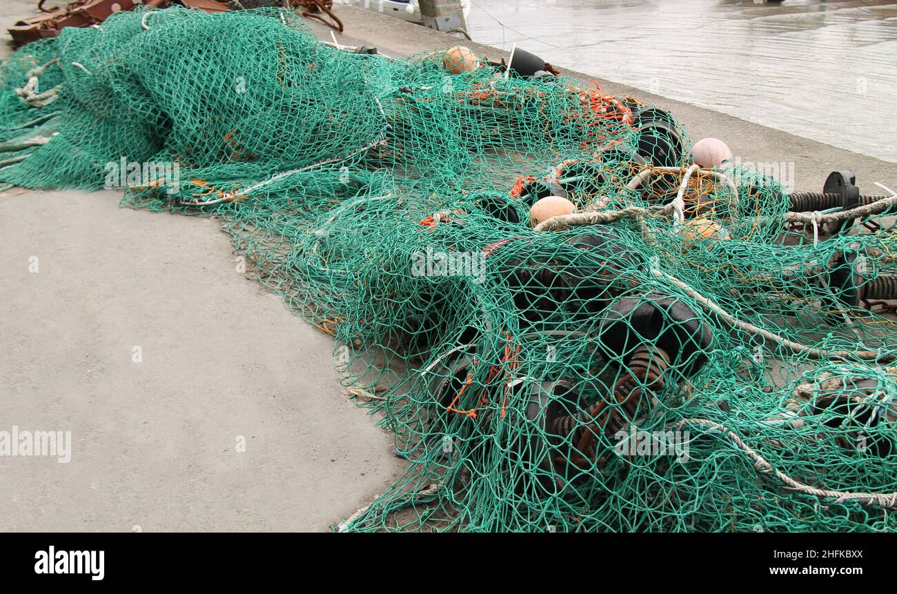 Traditional Sea Fishing Nets on a Harbour Wall Stock Photo - Alamy