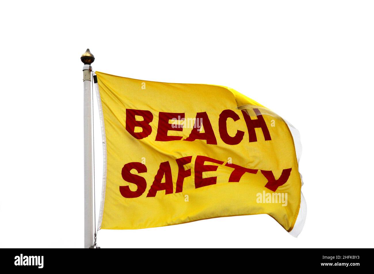 Red and yellow beach flag Cut Out Stock Images & Pictures - Alamy