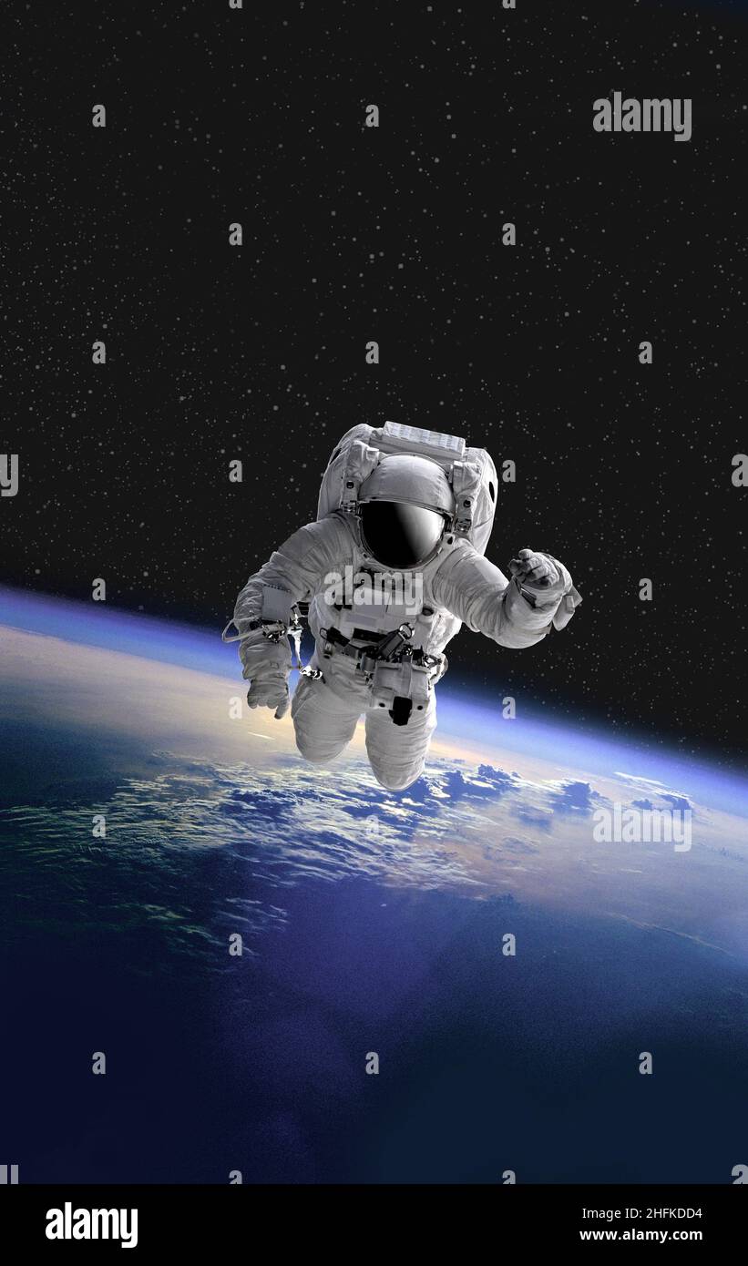 Astronaut in outer open space over the planet Earth.Stars provide ...