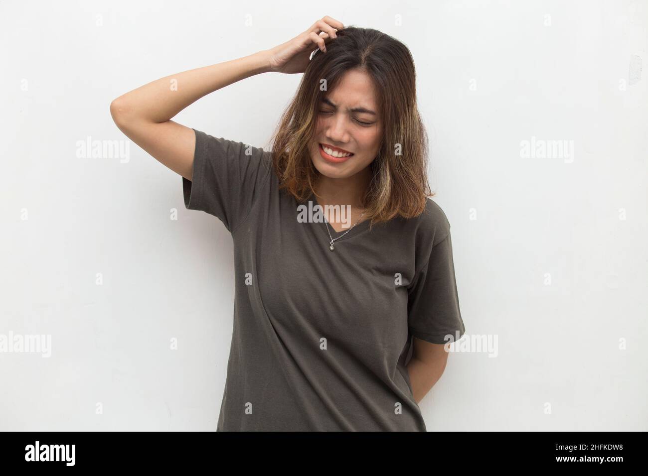 Closeup portrait of asian young woman scratching head with hand Stock ...