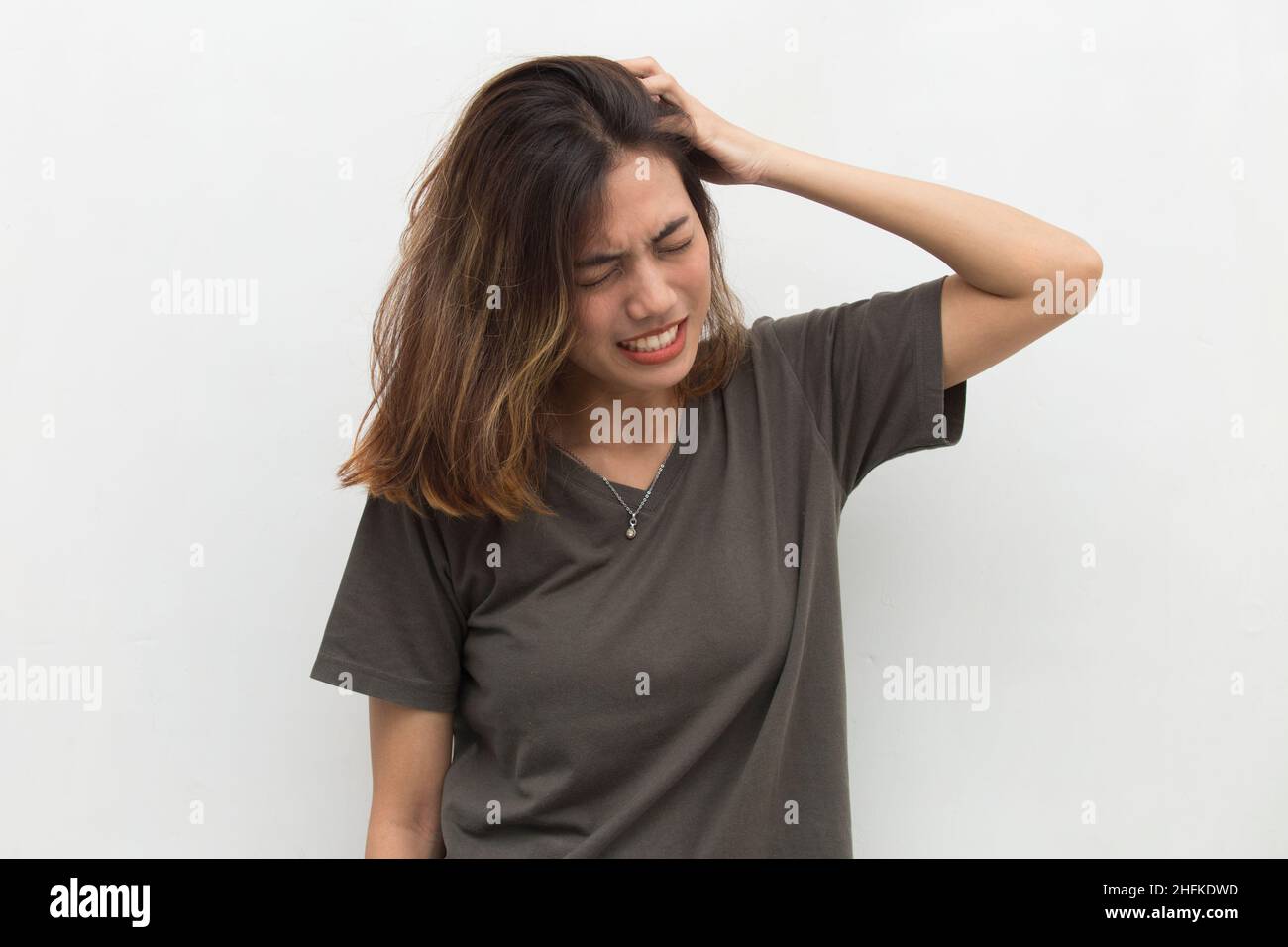 Closeup portrait of asian young woman scratching head with hand Stock ...