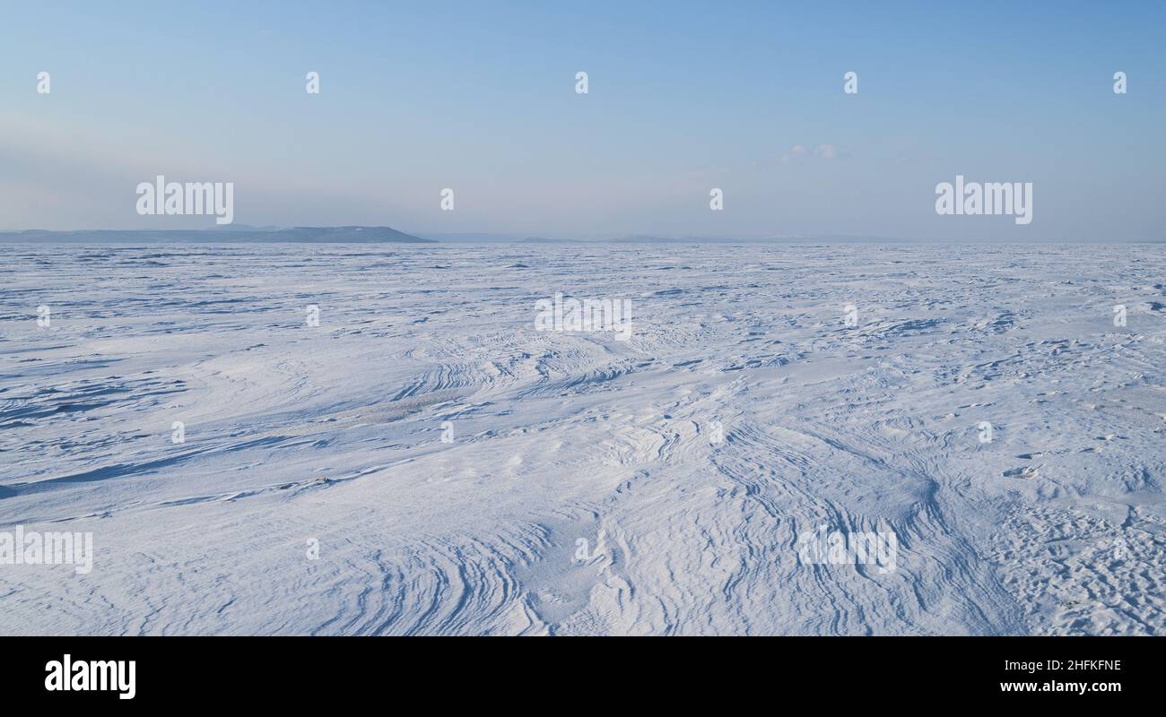 Winter landscape - frozen sea surface with snow Stock Photo - Alamy