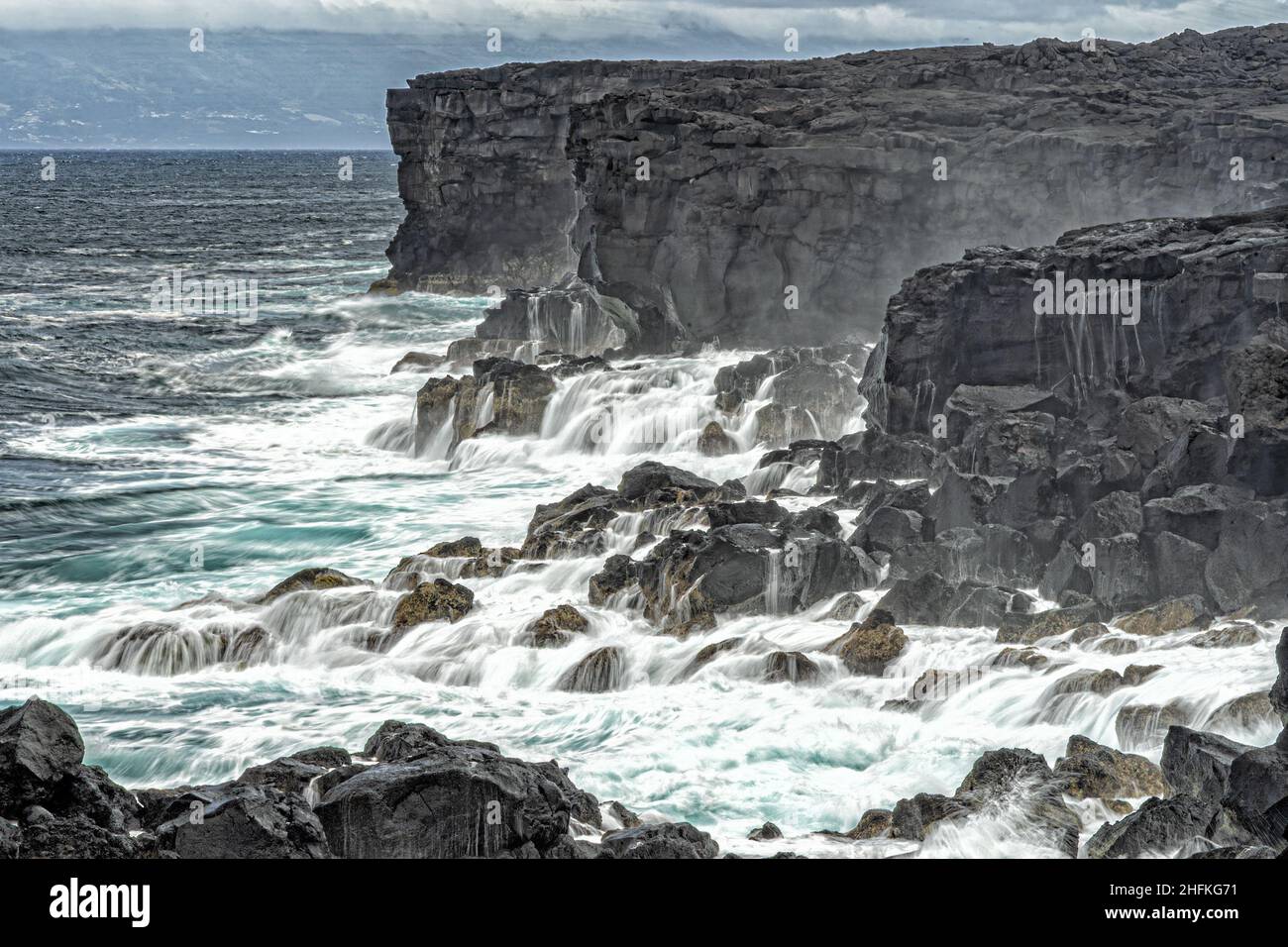 pico island waves on lava cliffs landscape Stock Photo - Alamy