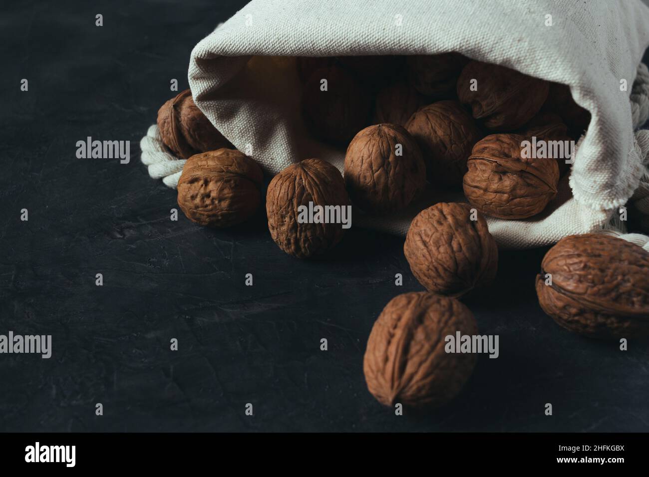 Sack of walnuts with copy space in dark mood shot Stock Photo - Alamy