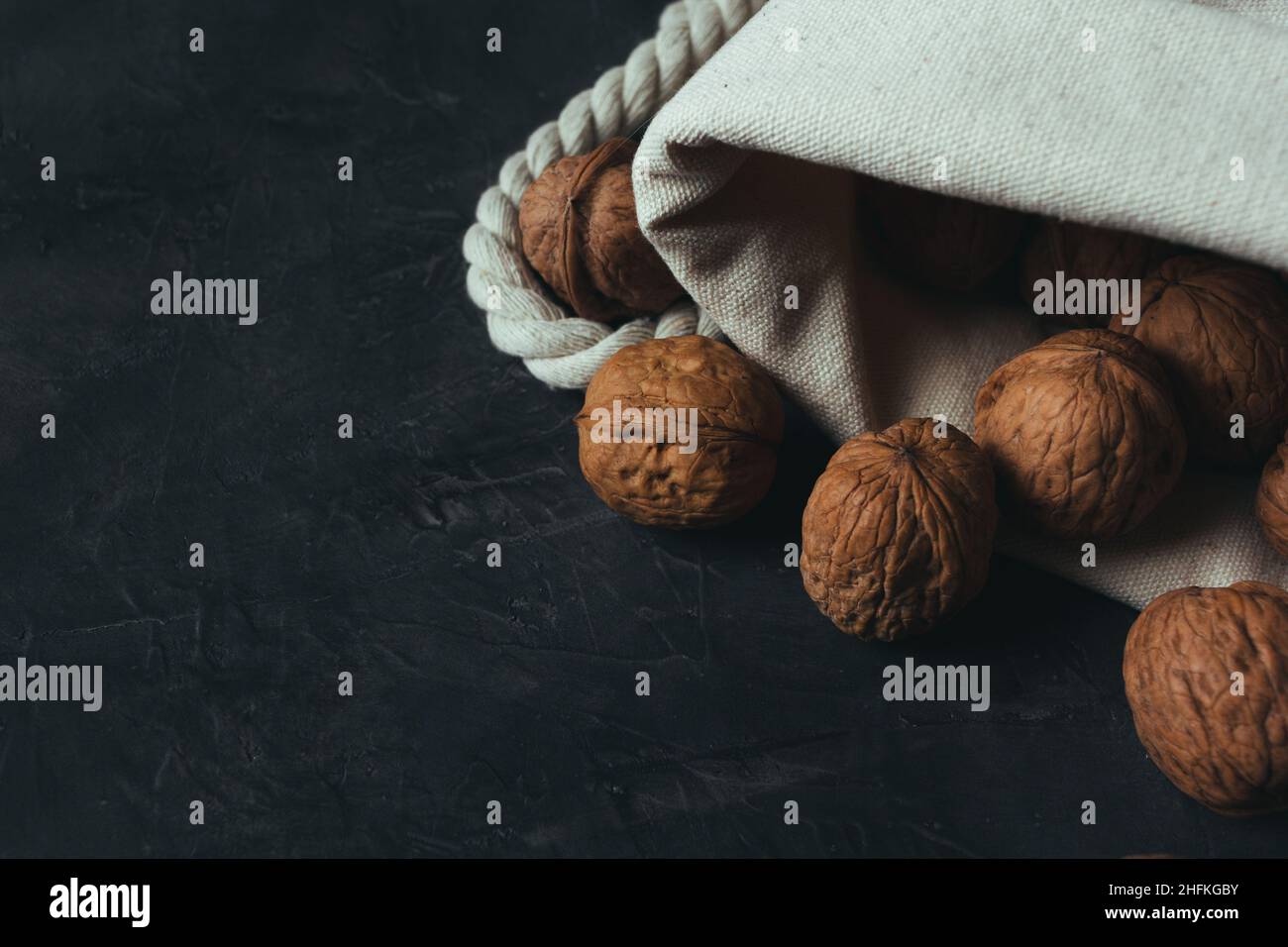 Sack of walnuts with copy space in dark mood shot Stock Photo - Alamy