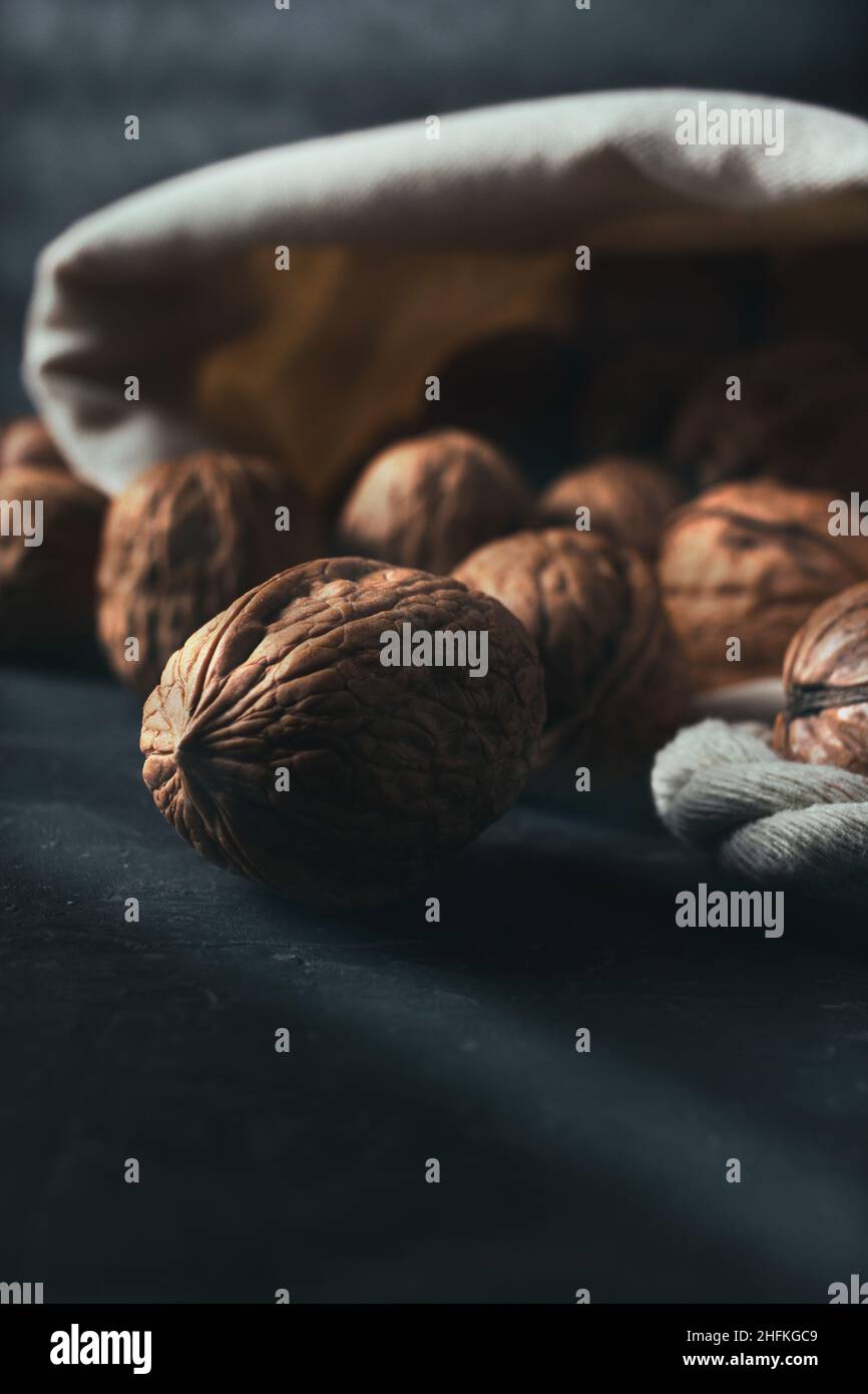 Sack of walnuts with copy space in dark mood shot Stock Photo - Alamy