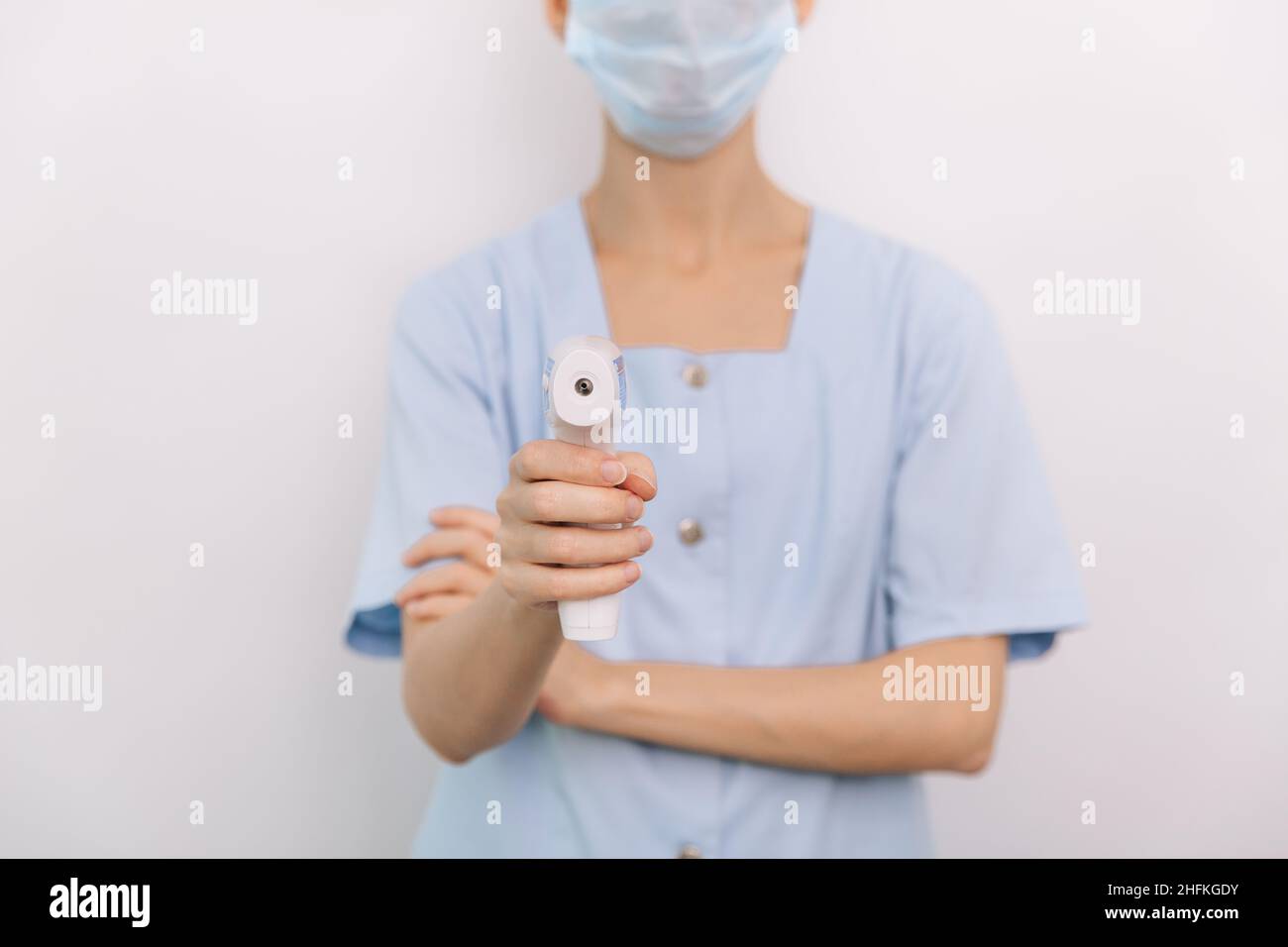 Temperature measurement gun in doctor hands. Close-up shot of doctor ...