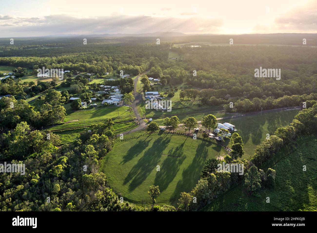 Aerial of the sun setting over the village of Yandaran Queensland ...