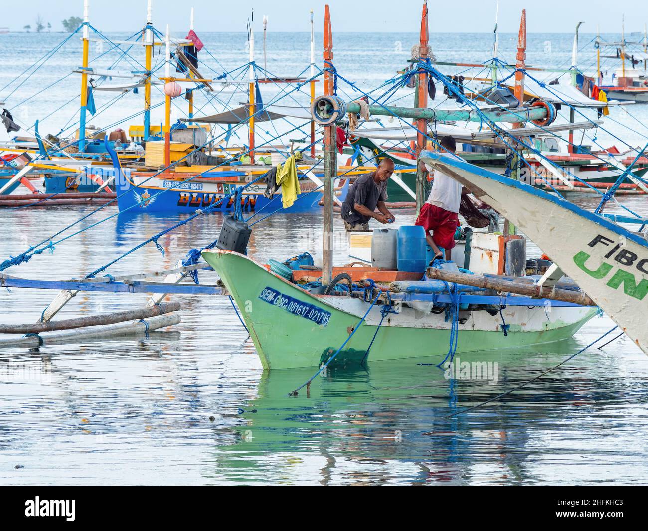 Tuna fishing boats at high tide at the village of Tinoto, Maasim in the ...