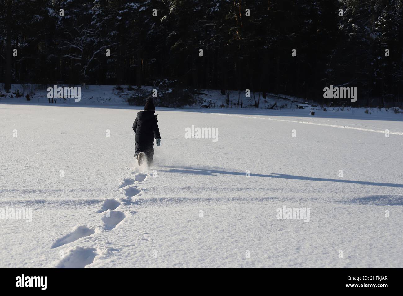 Boy in a snowy landscape hi-res stock photography and images - Alamy