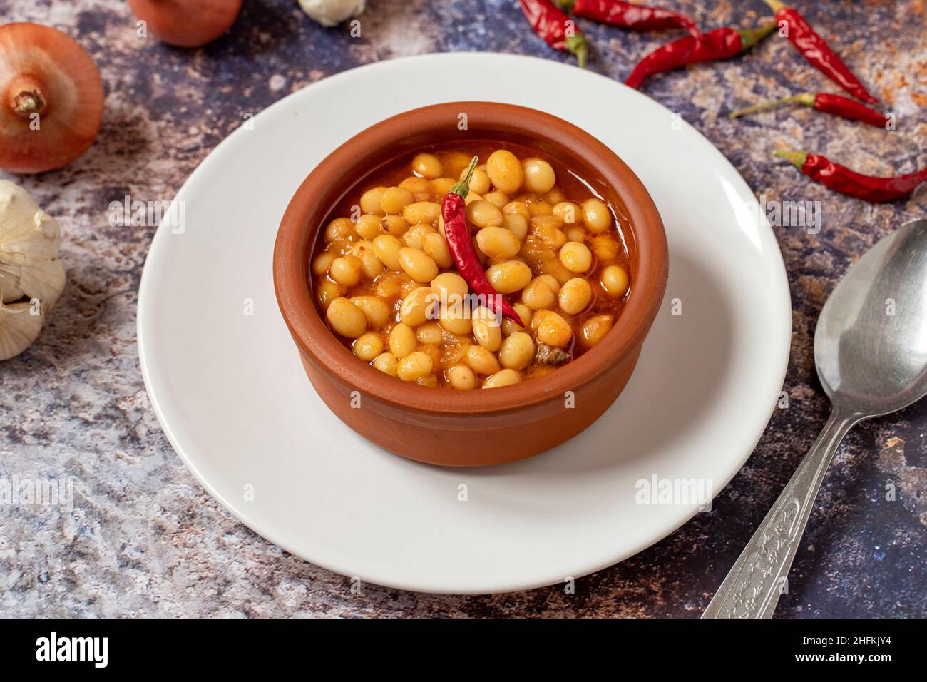 Hot turkish bean stew on wooden background. Ispir beans cooked in a ...