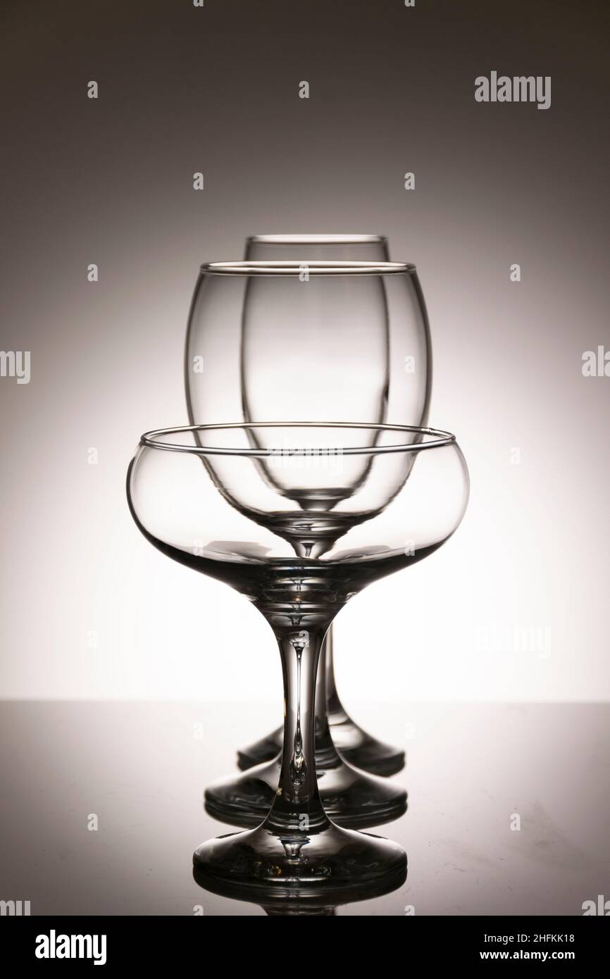 Glassware of different sizes against monochrome background Stock Photo ...