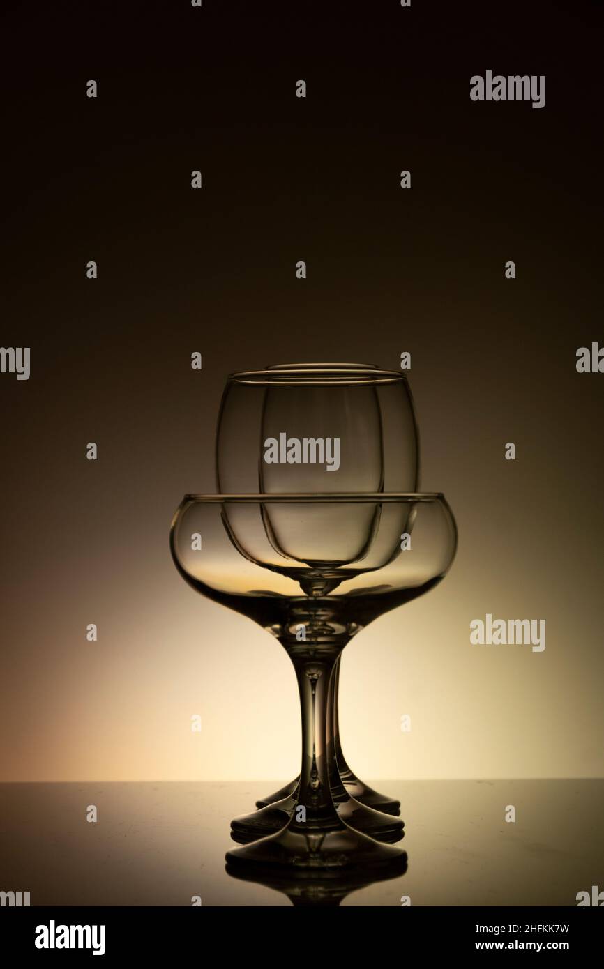 Glassware of different sizes against colorful background Stock Photo ...