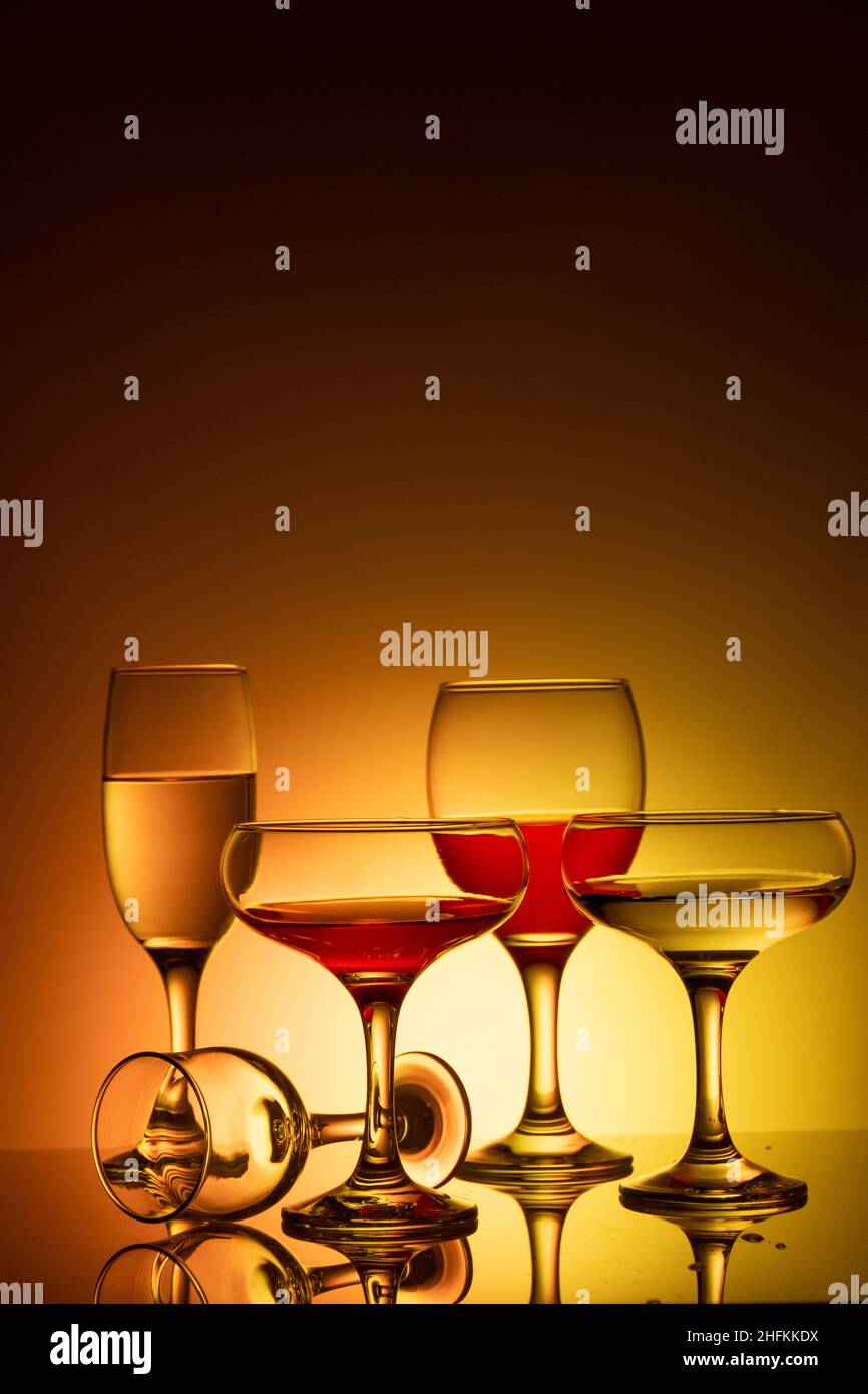 Glassware of different sizes against colorful background Stock Photo ...