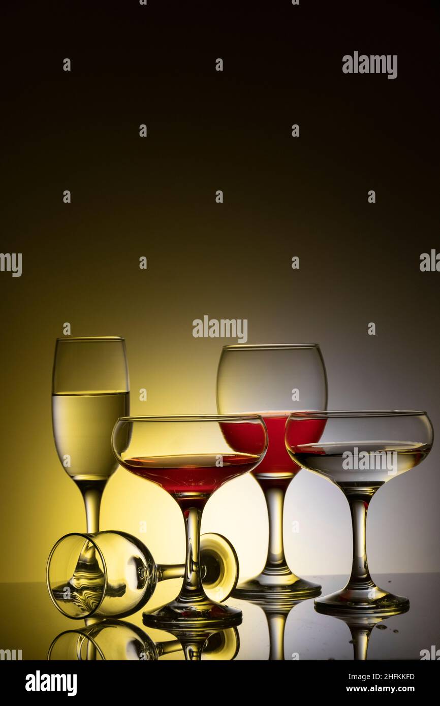 Glassware of different sizes against colorful background Stock Photo ...