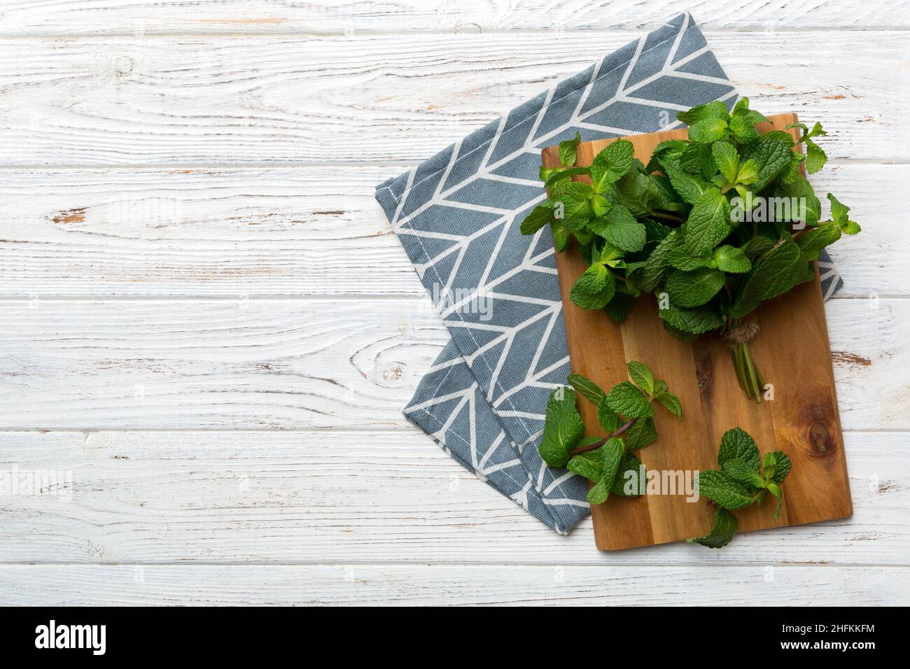 Fresh mint on Cutting board table, top view. Flat lay Space for text ...