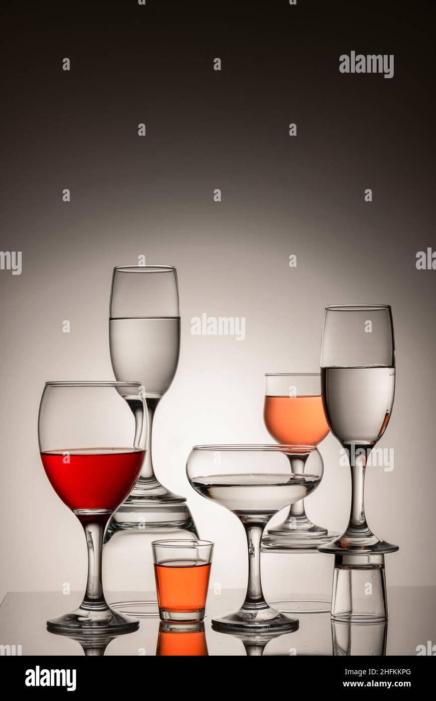 Glassware of different sizes against monochrome background Stock Photo ...