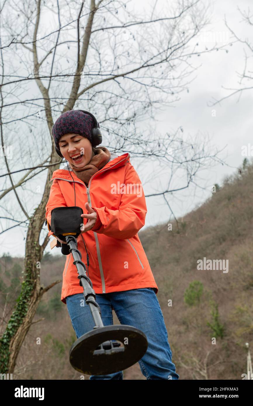 a young girl rejoices at what the metal detector indicates Stock Photo ...