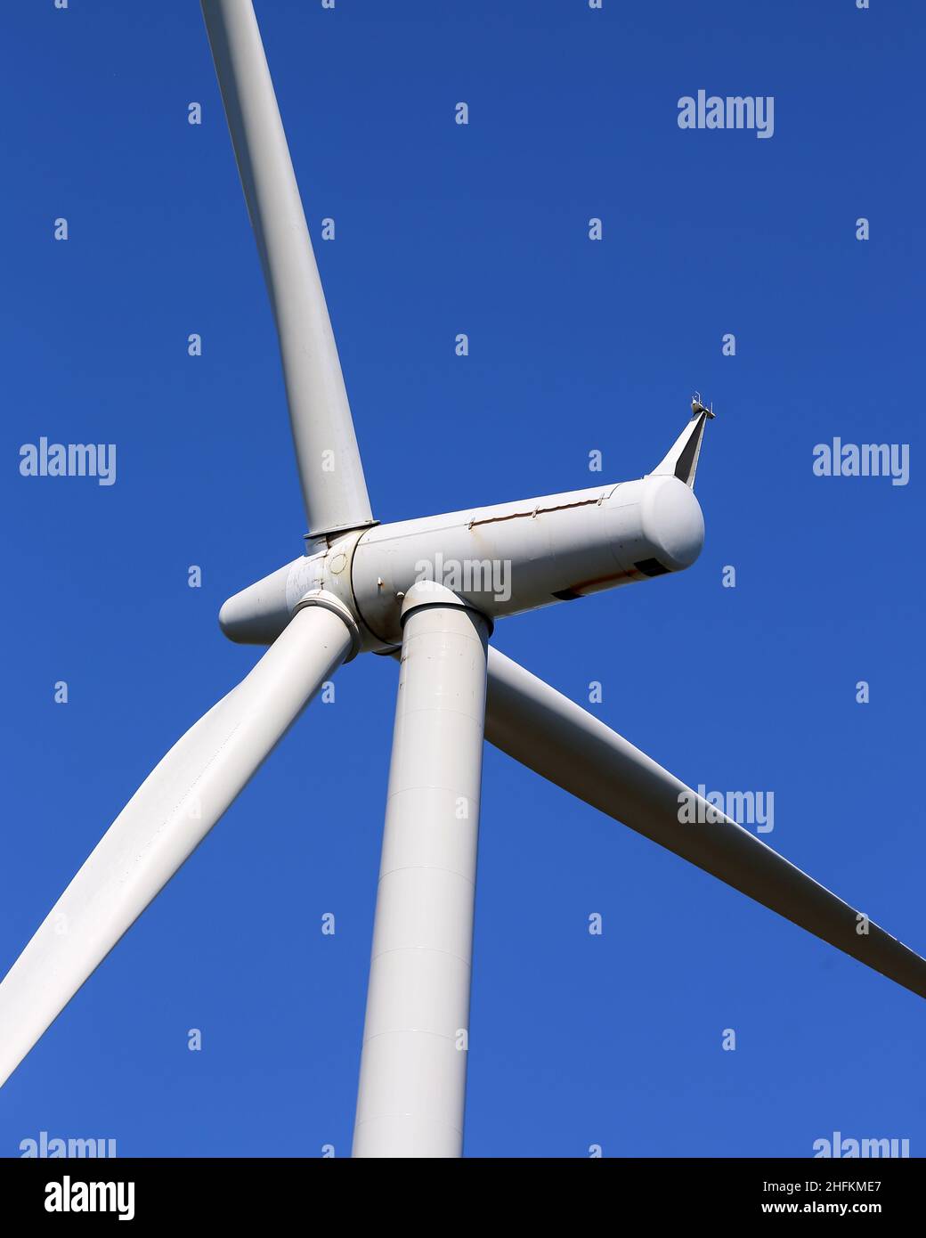 Wind generator closeup on the blue background with sun light Stock ...
