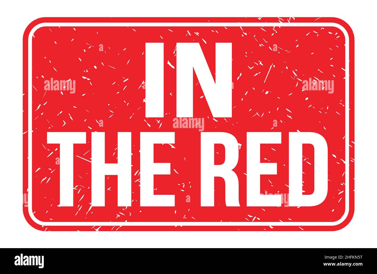 IN THE RED, words written on red rectangle stamp sign Stock Photo - Alamy