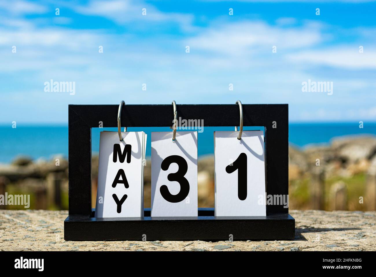May 31 calendar date text on wooden frame with blurred background of ...