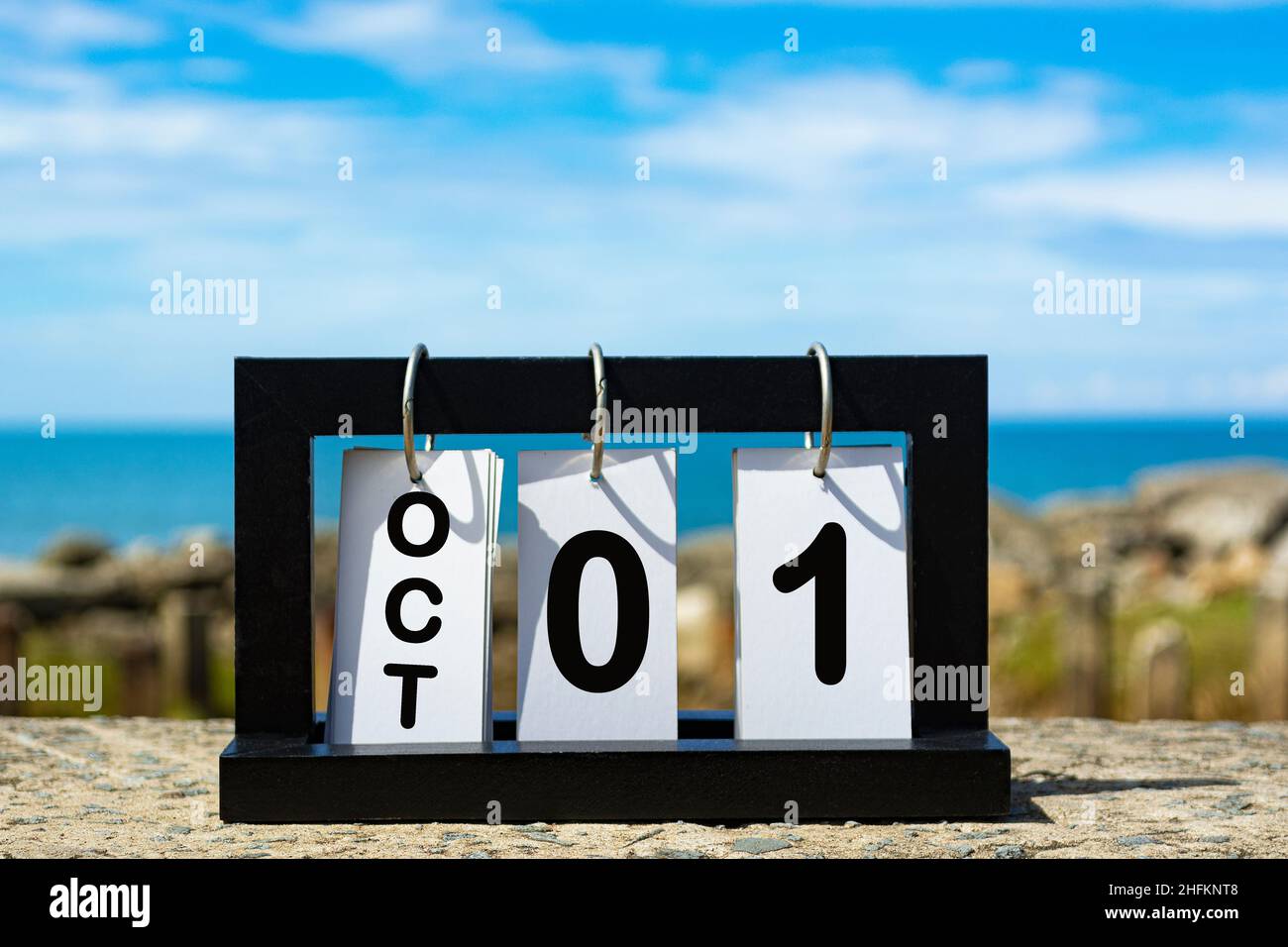 Oct 01 calendar date text on wooden frame with blurred background of ...