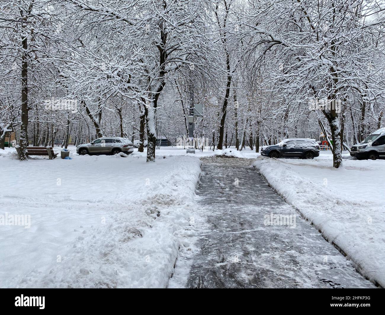 winter in city yard at cloudy day after snowfall Stock Photo - Alamy