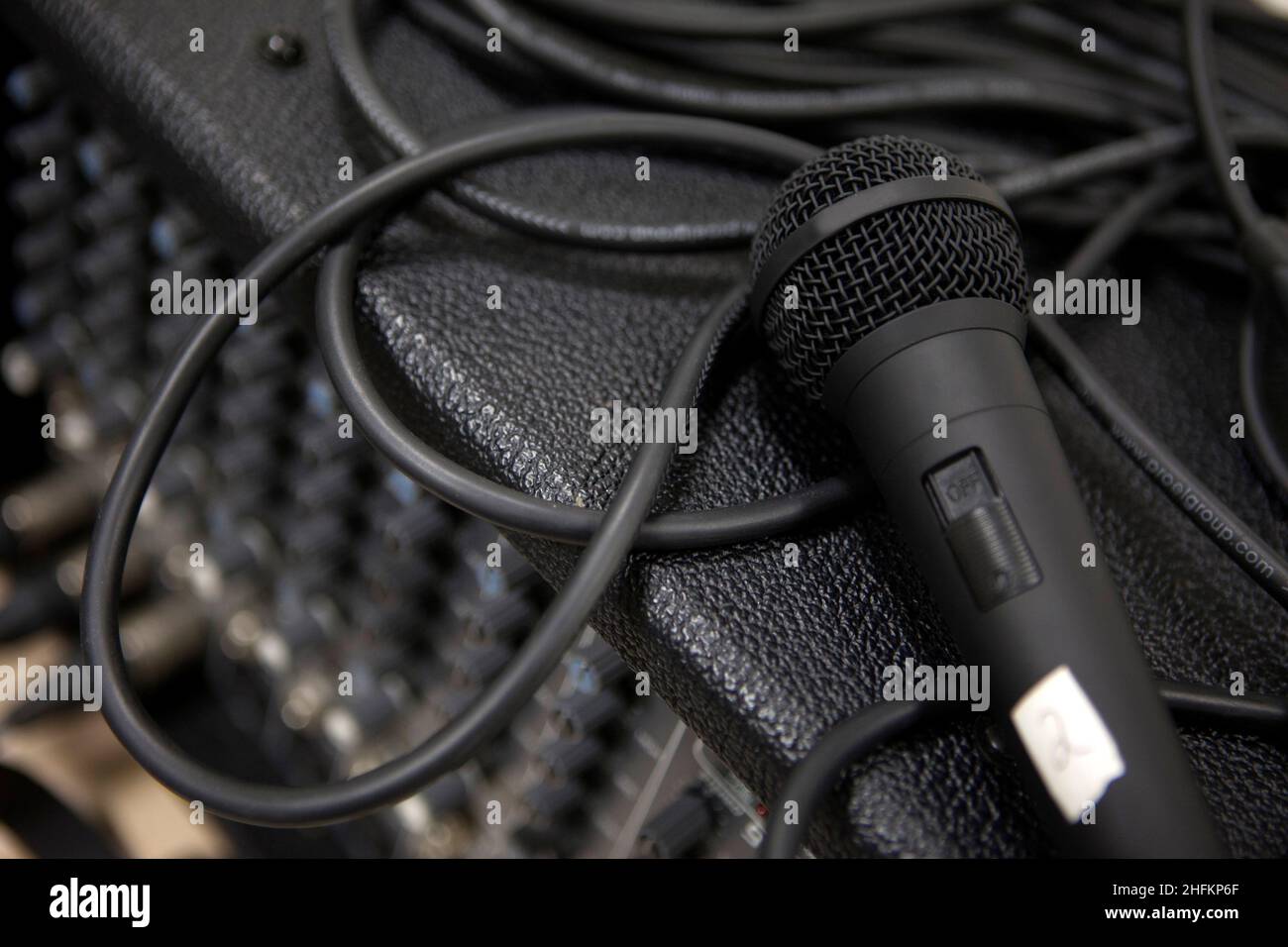 Microphone laying on amplifier Stock Photo - Alamy