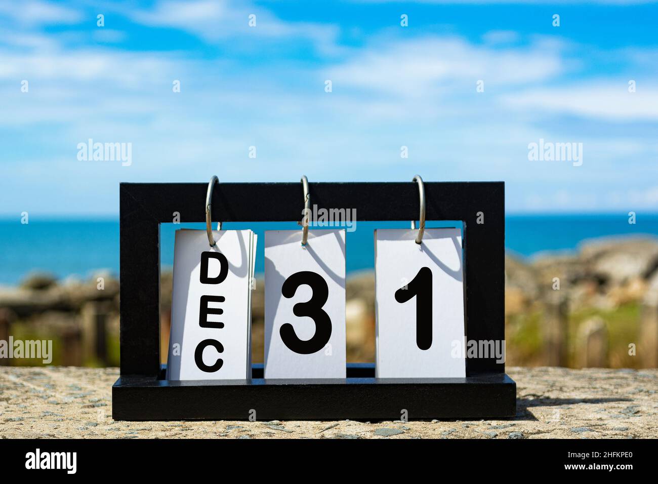 Dec 31 calendar date text on wooden frame with blurred background of ...
